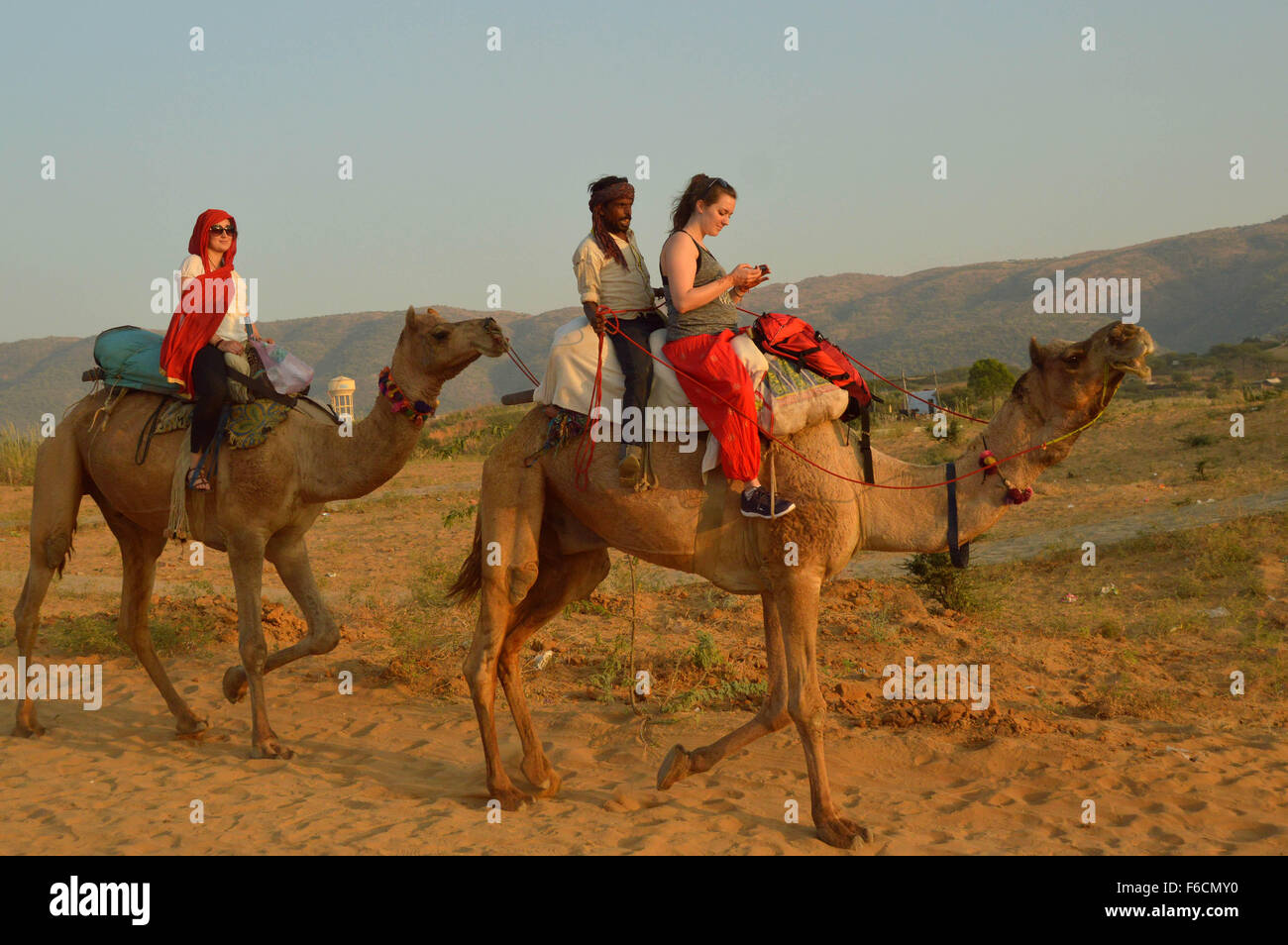 Rajasthan, India. 15th Nov, 2015. Tourists enjoy camel ride in "Annual Cattle Fair" in Pushkar ...