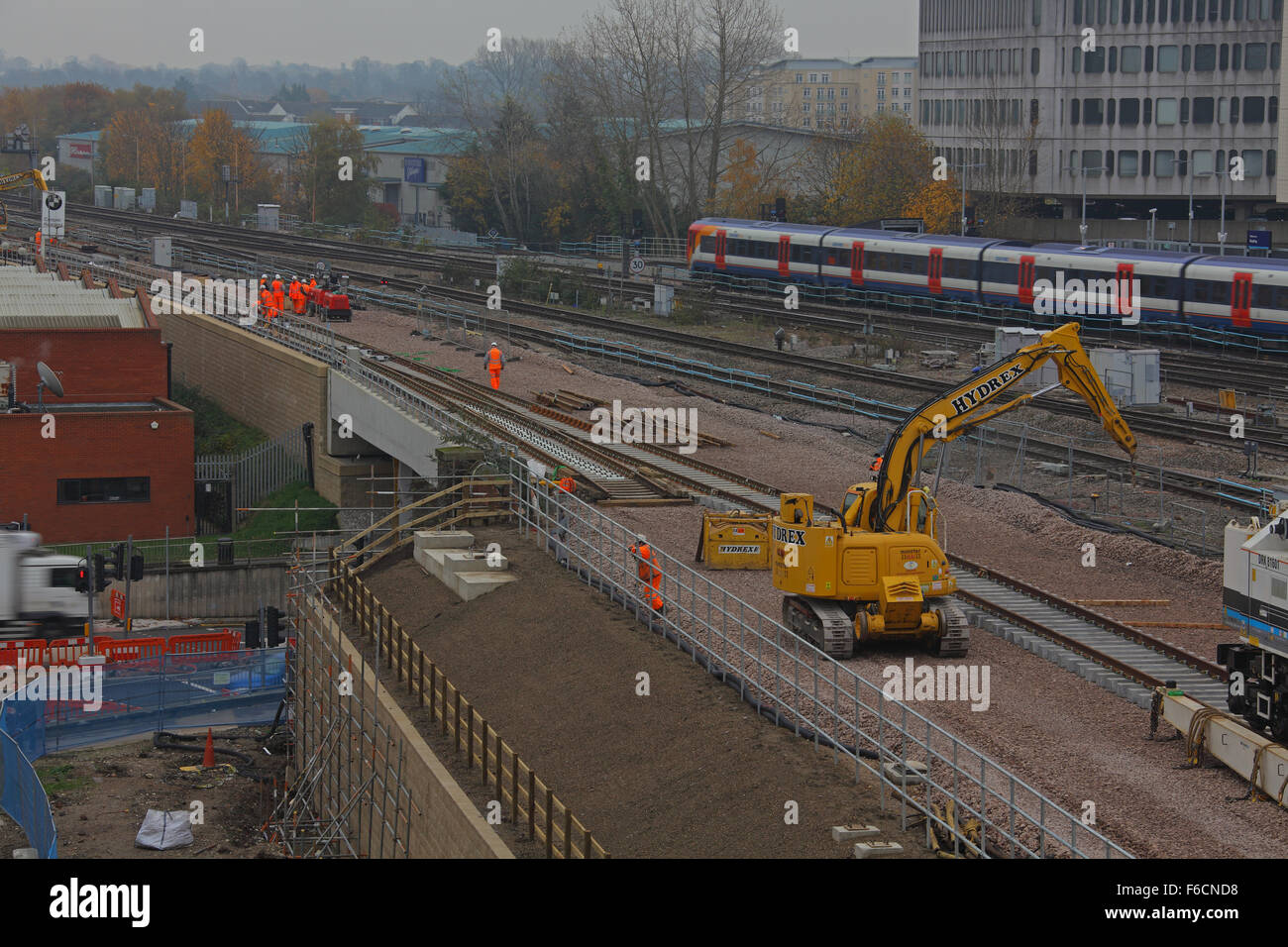 Showing track machinery and workers at work along the tracks with an ...