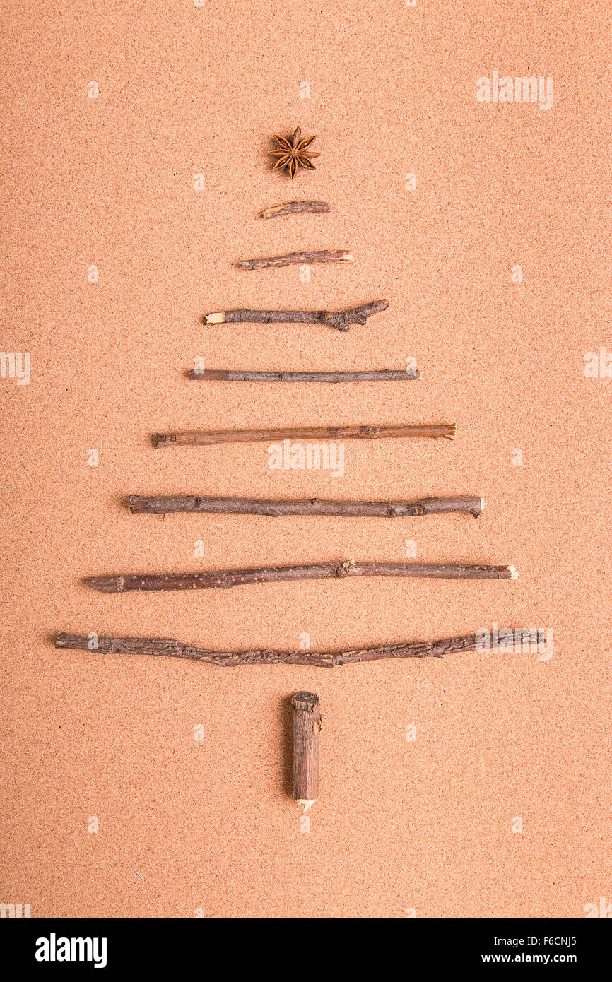 Christmas tree arranged from sticks on wood background Stock Photo - Alamy