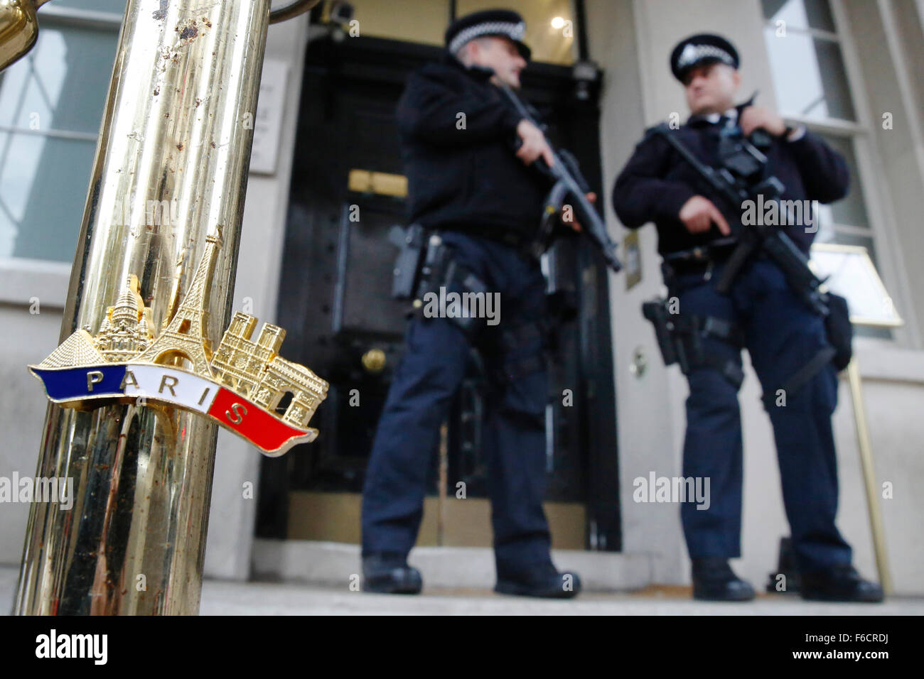 London, UK. 16th Nov, 2015. Armed police officers patrol outside the ...