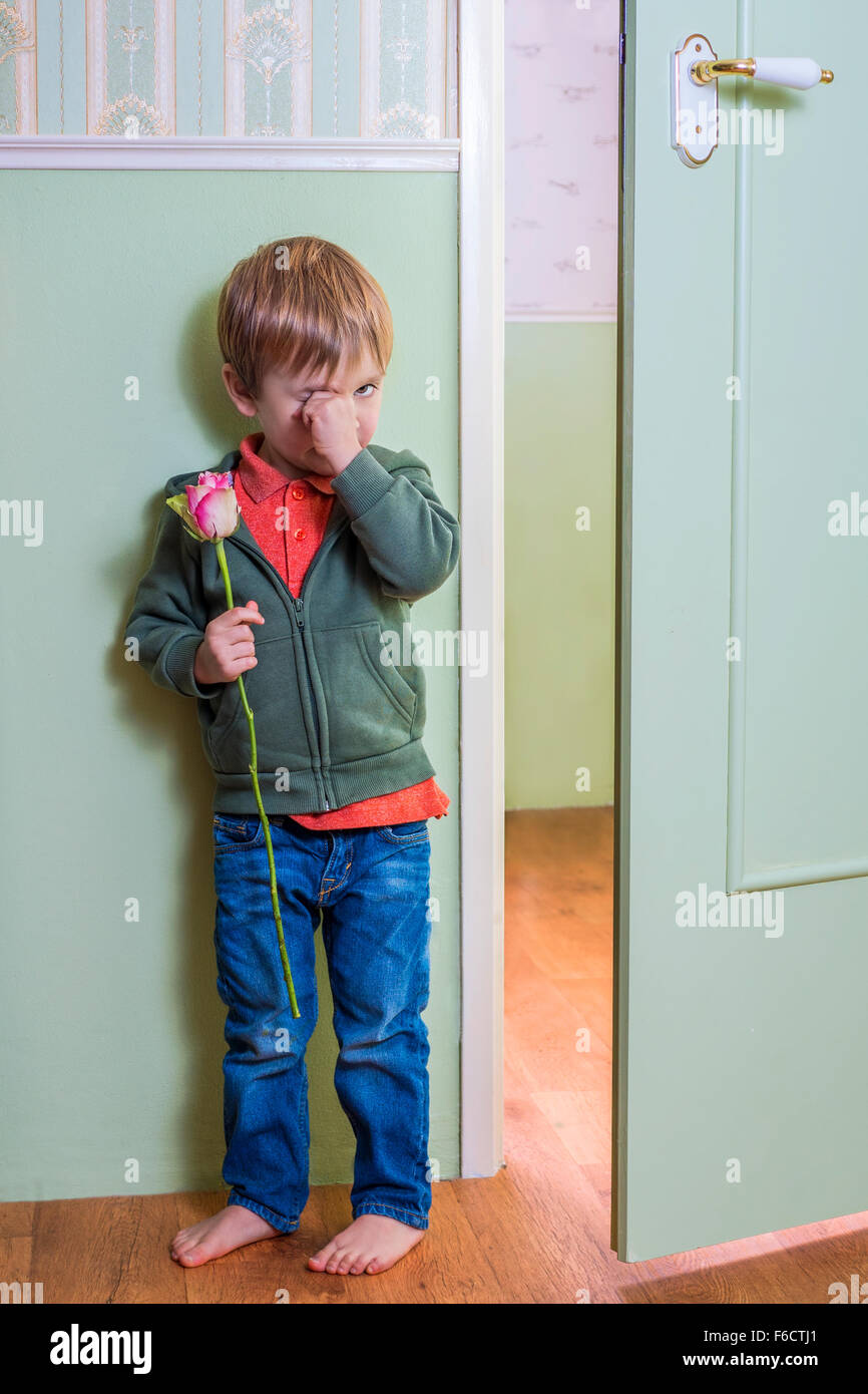 Adorable child holding rose hi-res stock photography and images - Alamy
