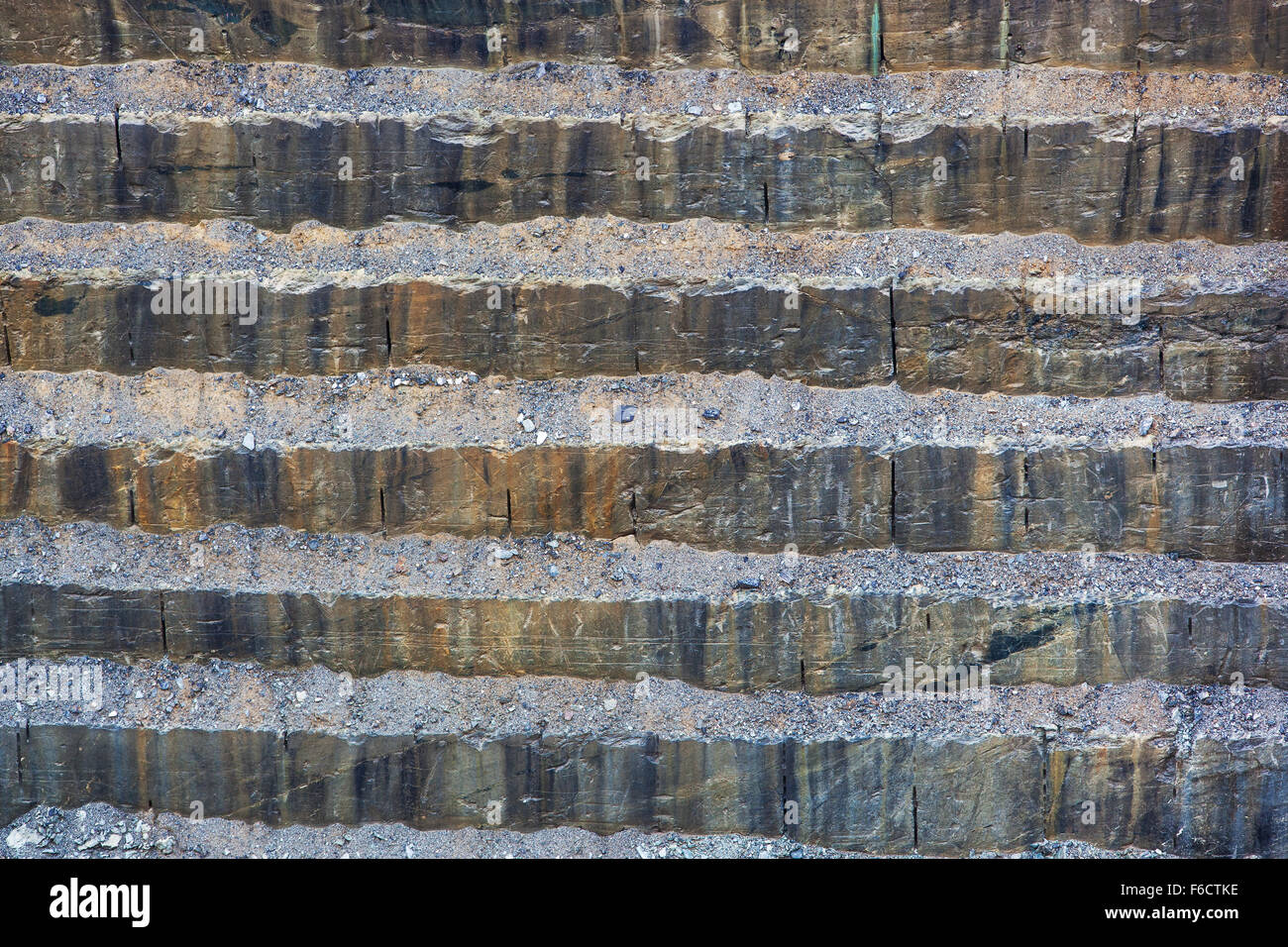 Stone quarry. Layers of stones going down under ground Stock Photo - Alamy