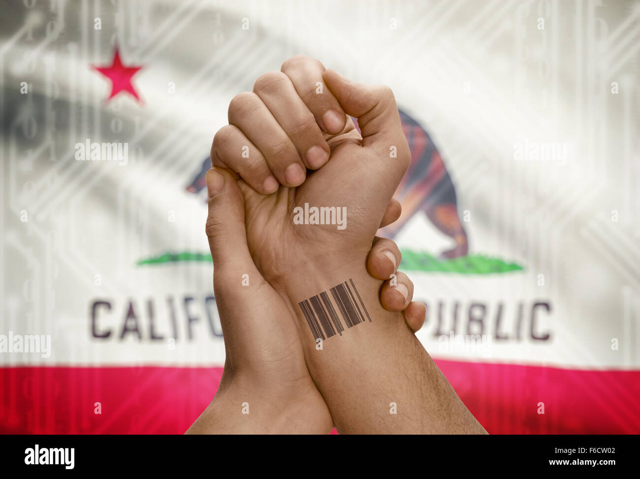Barcode ID number tattoo on wrist of dark skinned person and USA states ...
