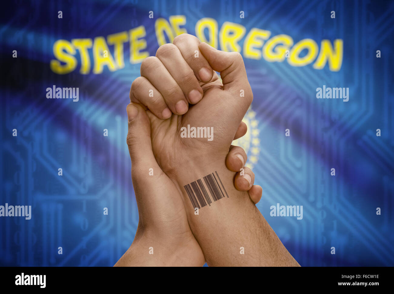 Barcode ID number tattoo on wrist of dark skinned person and USA states ...
