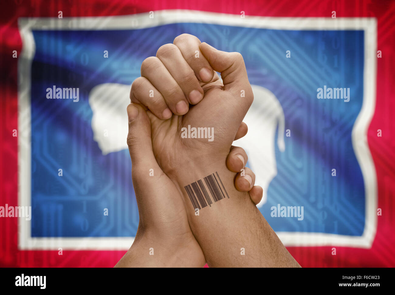 Barcode ID number tattoo on wrist of dark skinned person and USA states ...