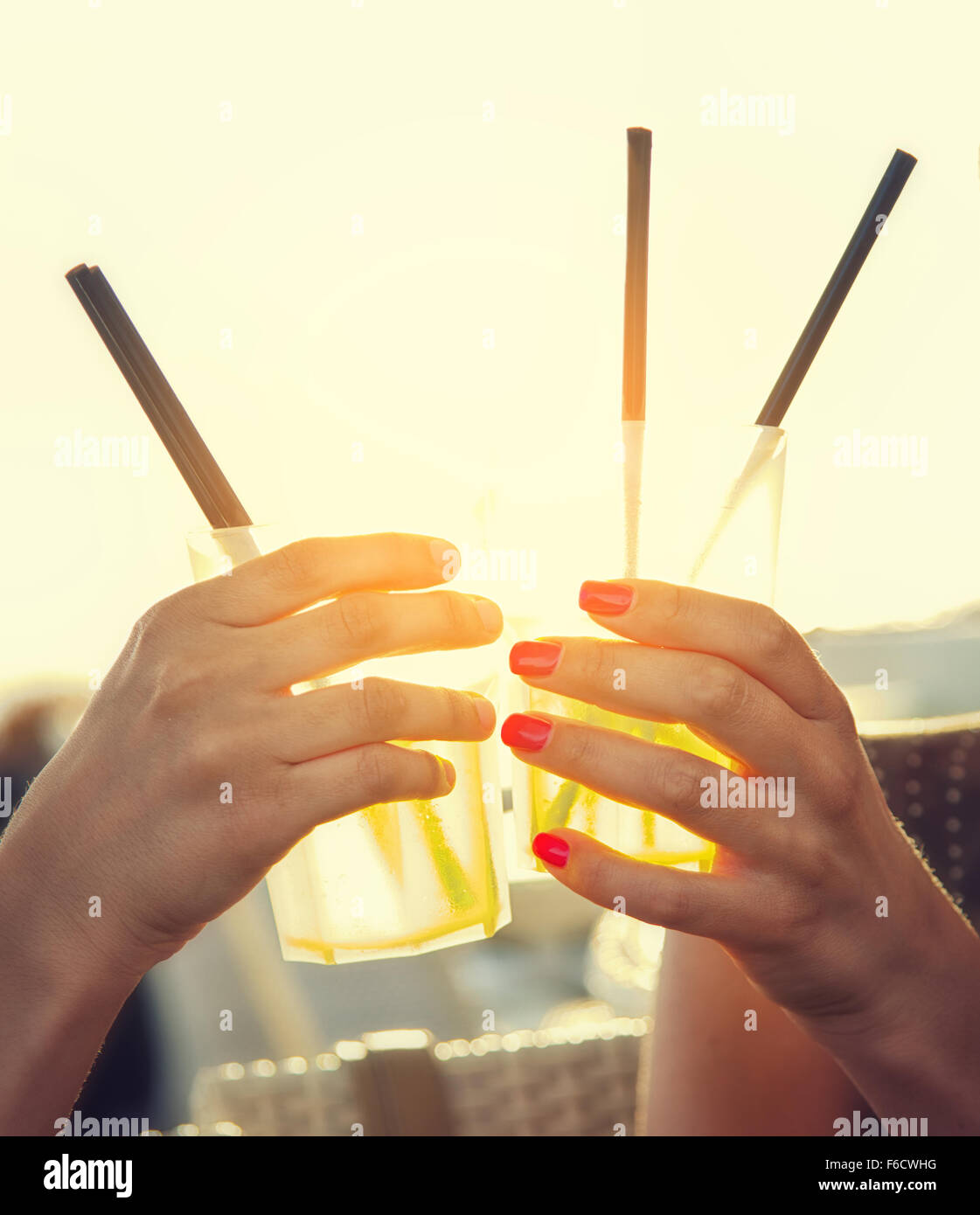 Group of young friends clicking with cocktails Stock Photo - Alamy