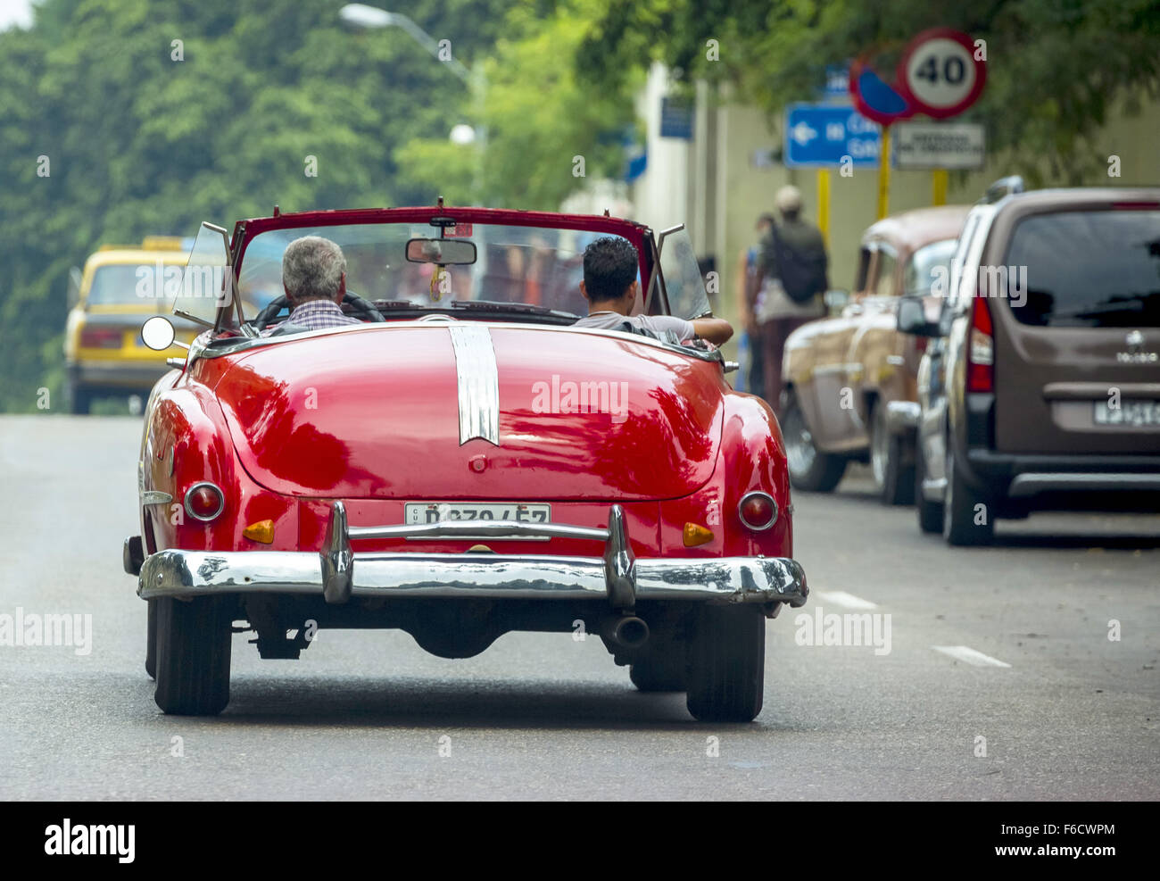 red vintage convertible in the streets, old American road cruiser on ...