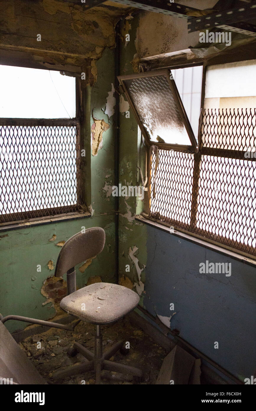 Closed factory with an empty seat in Belgium Stock Photo - Alamy