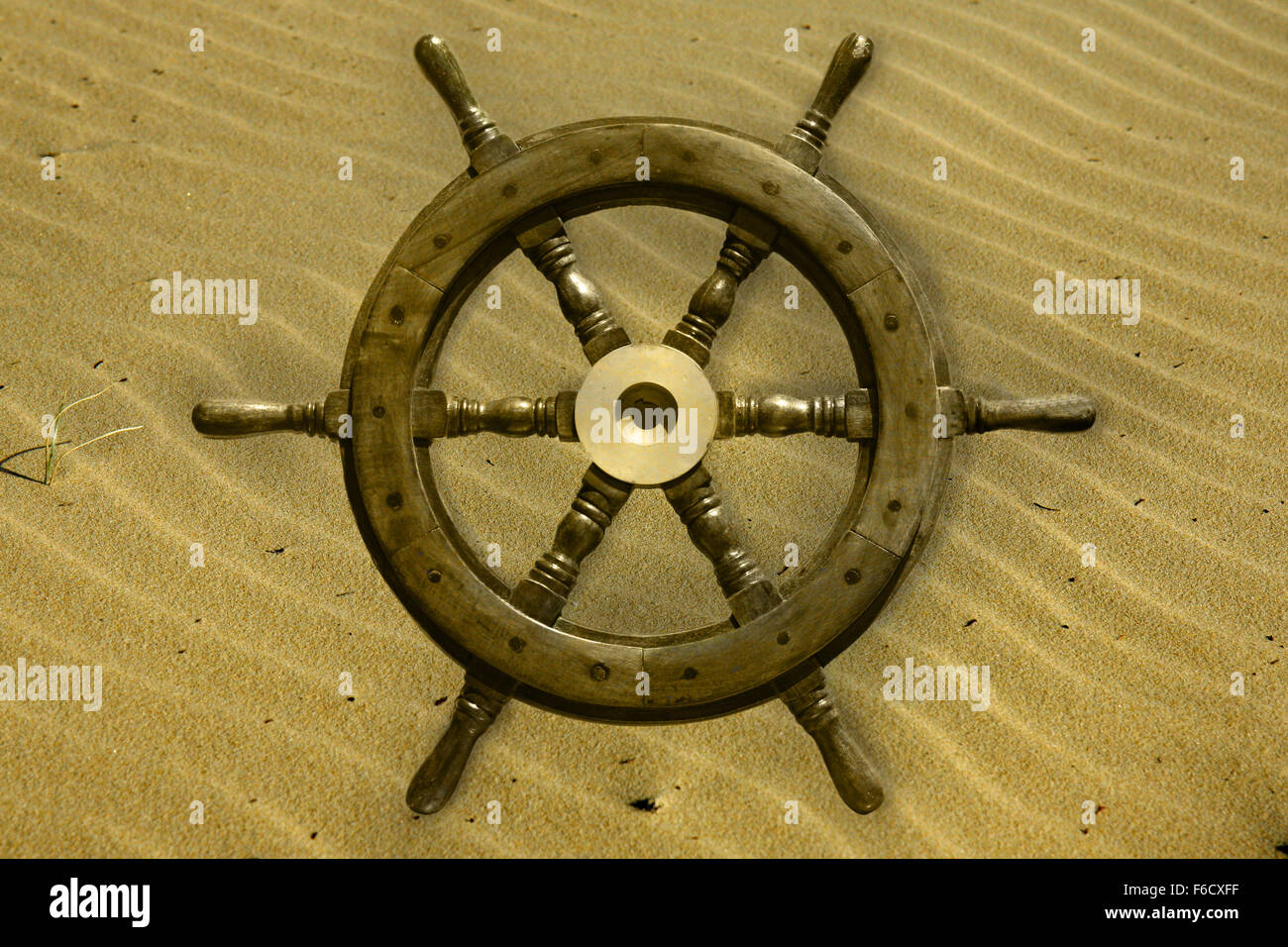 Old boat wheel laying on the sand hi-res stock photography and images ...