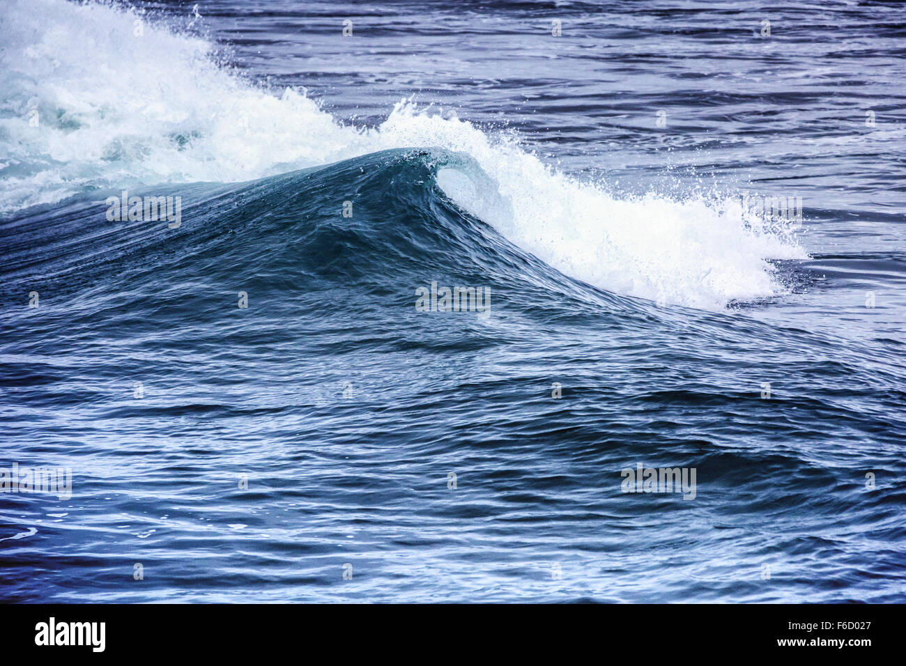 Blue small wave Stock Photo - Alamy