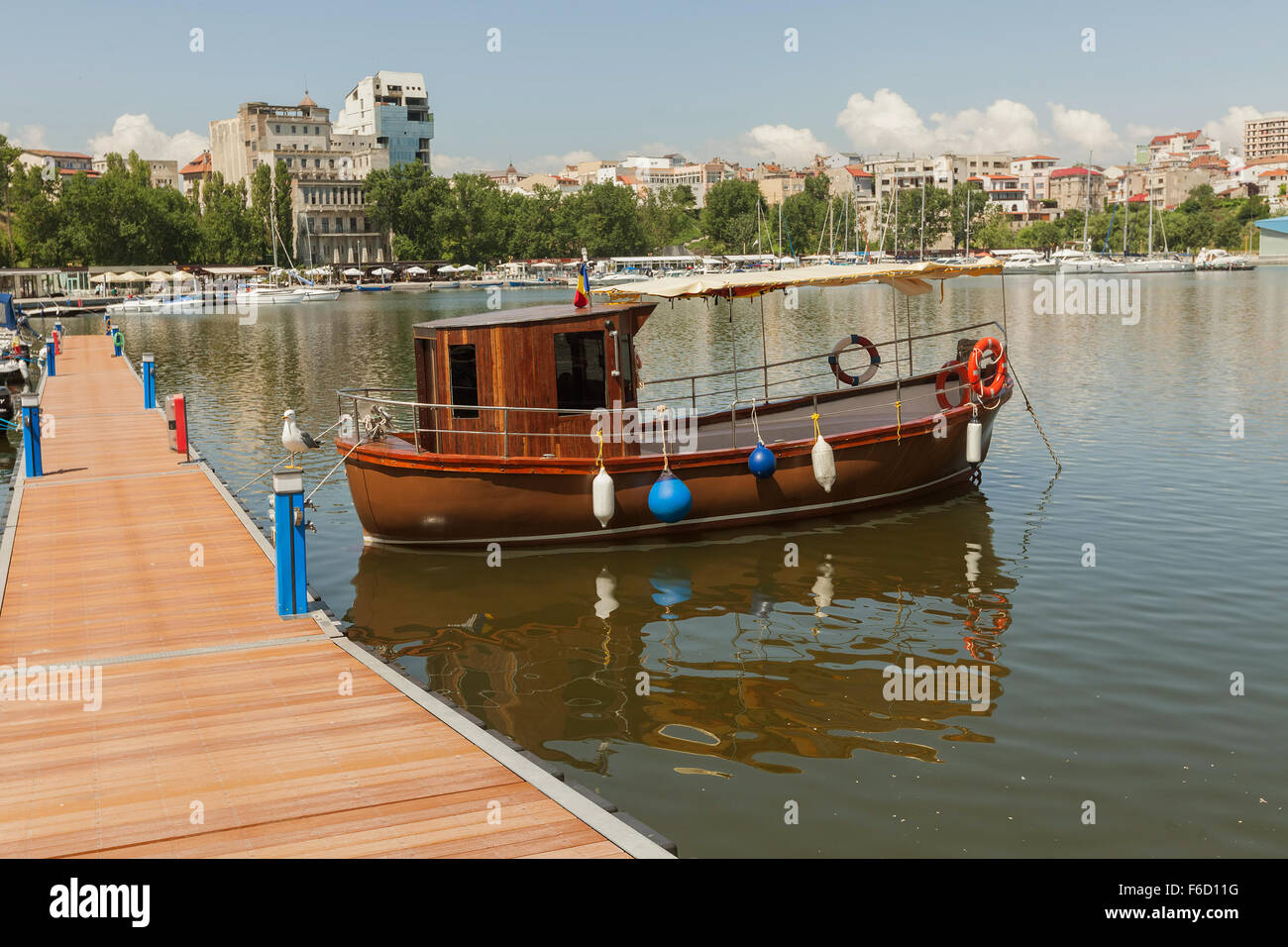 Old And Restored Wooden Boat Anchored In The Port Of Constanta, Romania ...