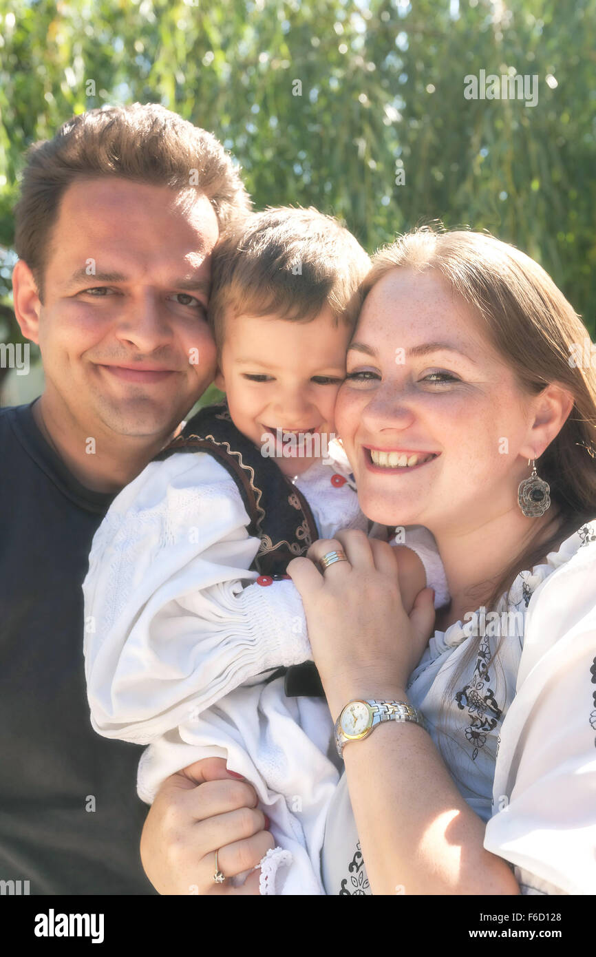 Happy Peasant Child Posing With His Mother And Father Stock Photo - Alamy