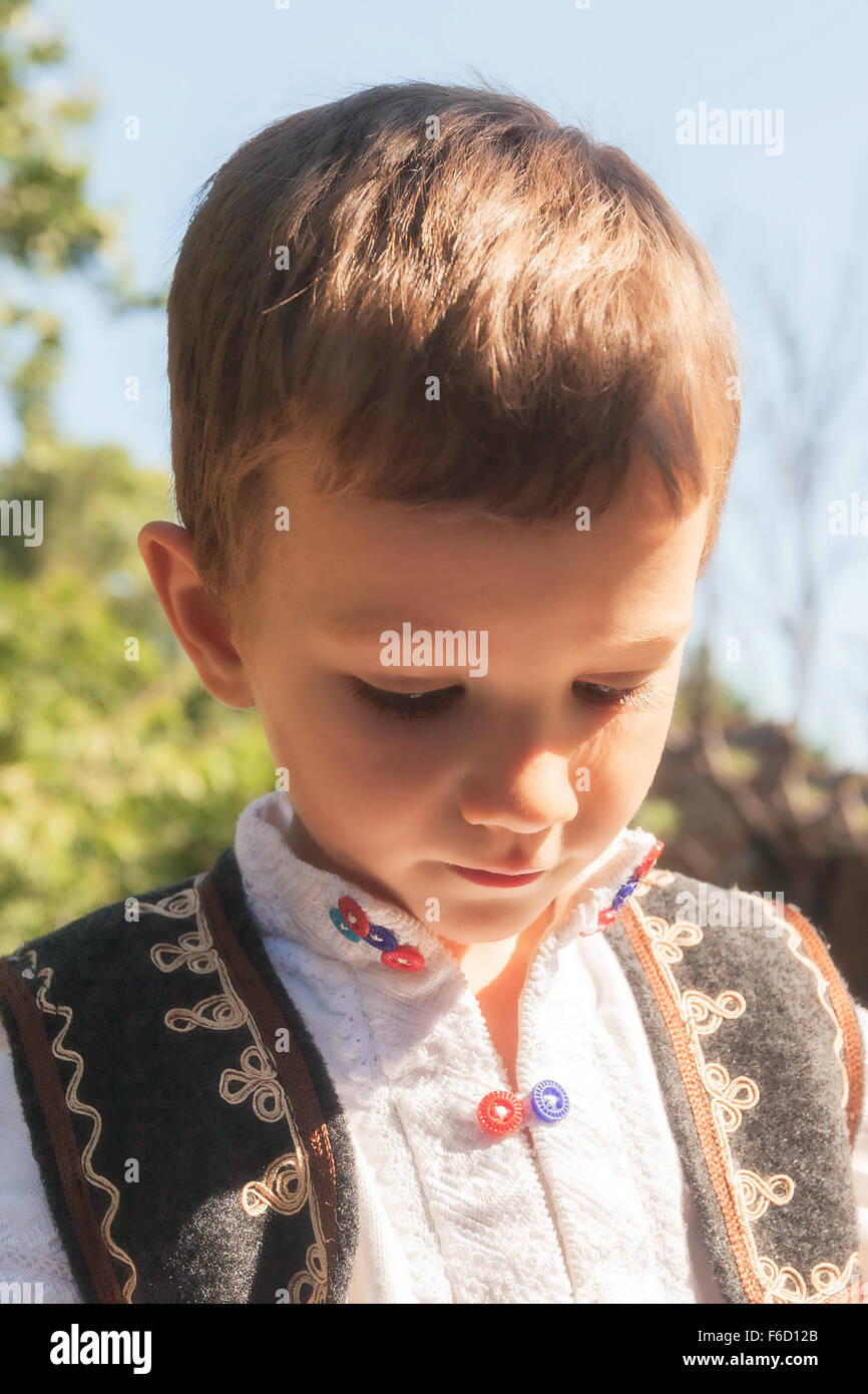 Portrait Of A Romanian Peasant Child Dressed In Traditional Romanian ...