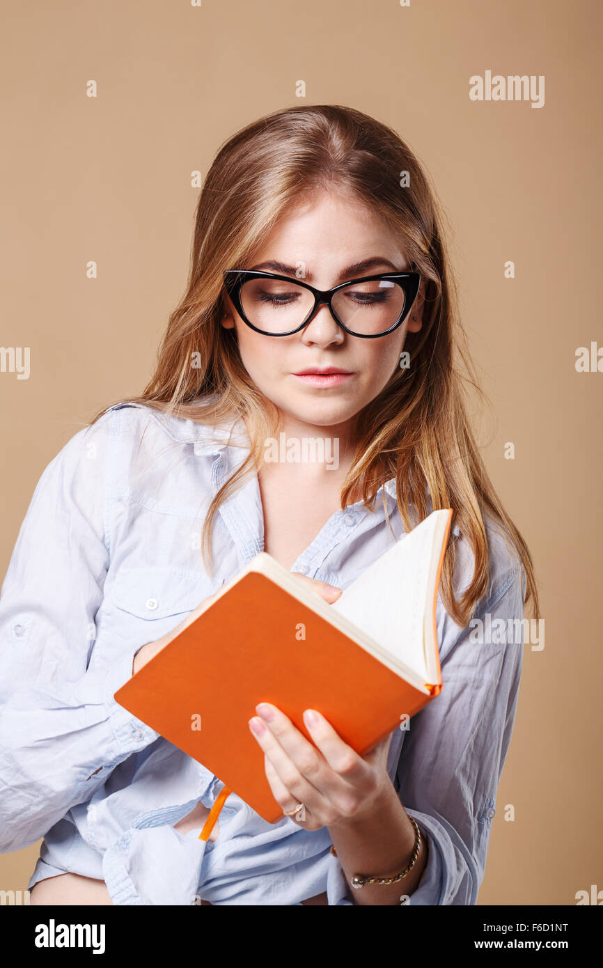 A young girl is holding a notebook. The poet is making notes in her ...