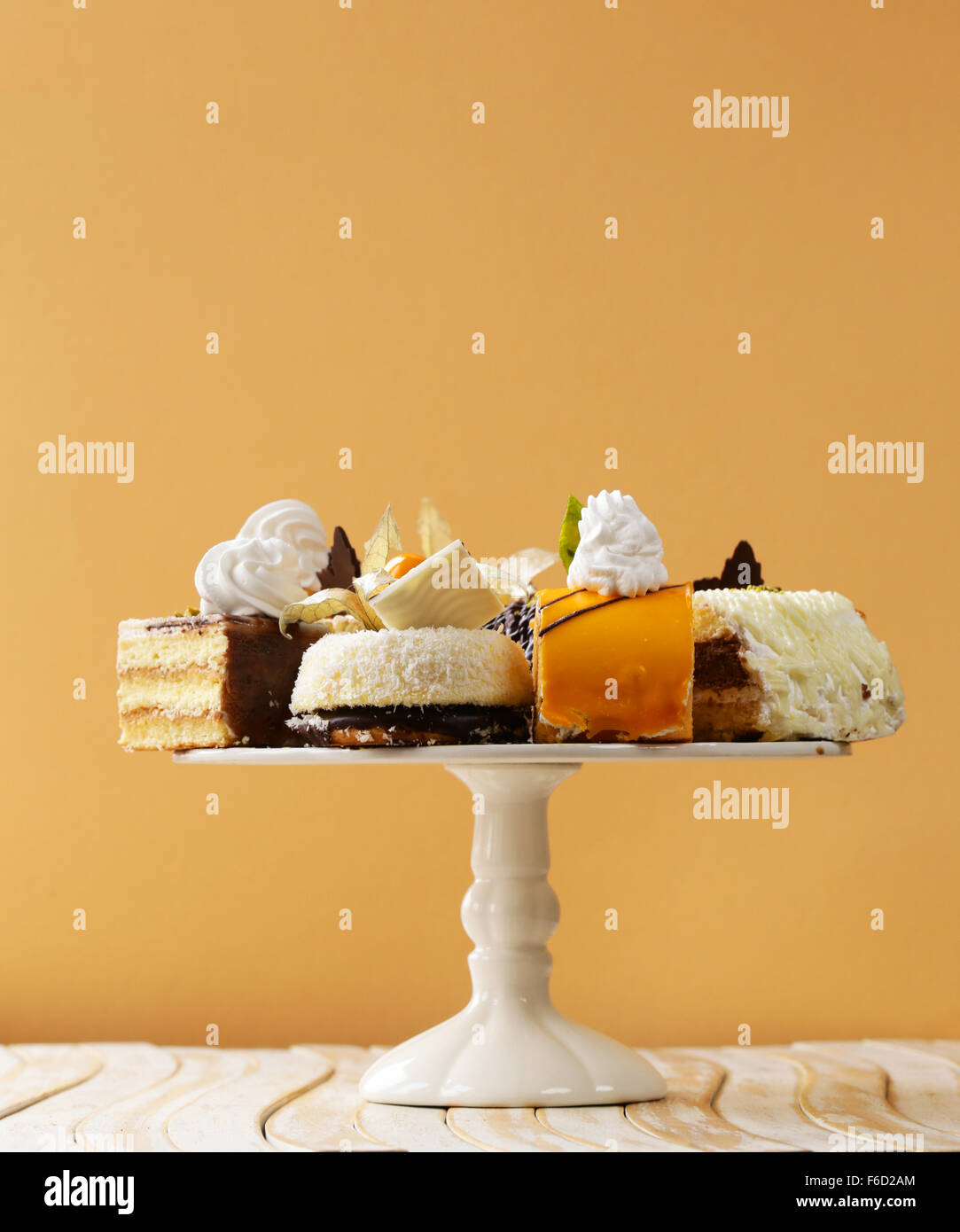 Assorted different mini cakes with cream, chocolate and berries Stock ...