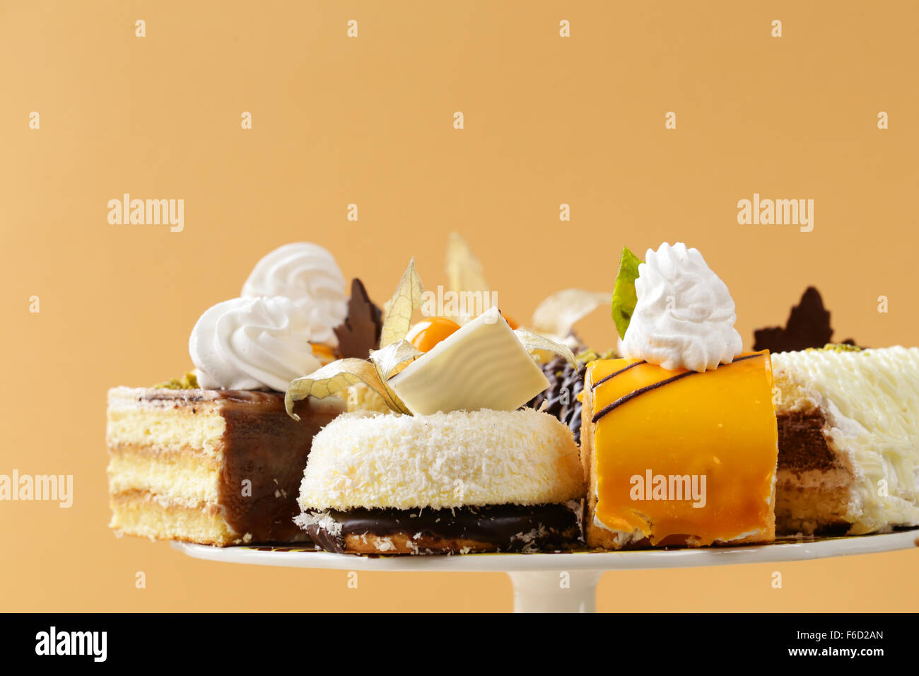 Assorted different mini cakes with cream, chocolate and berries Stock ...