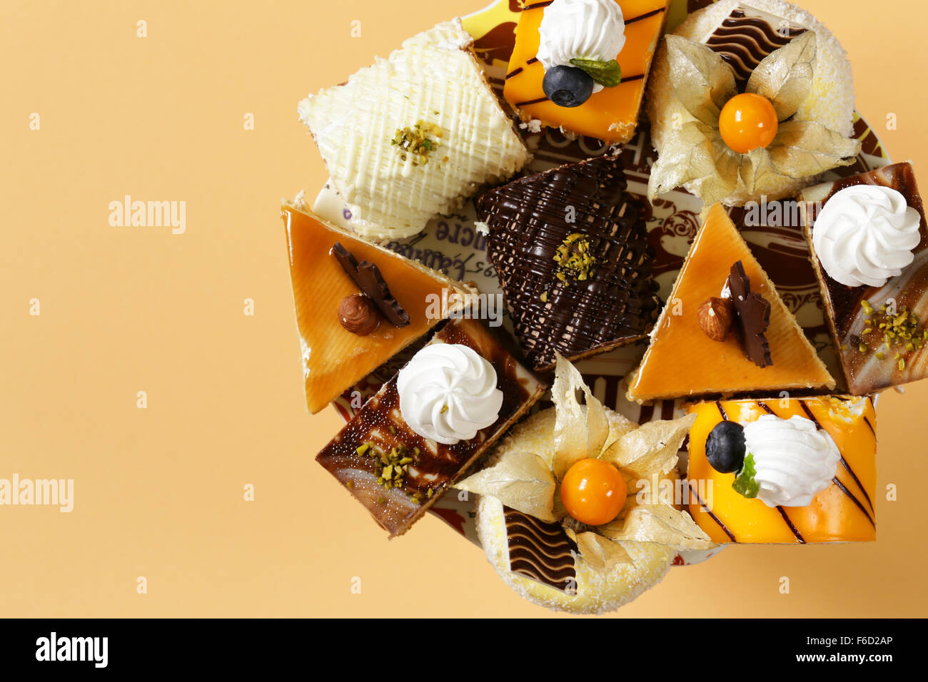 Assorted different mini cakes with cream, chocolate and berries Stock ...