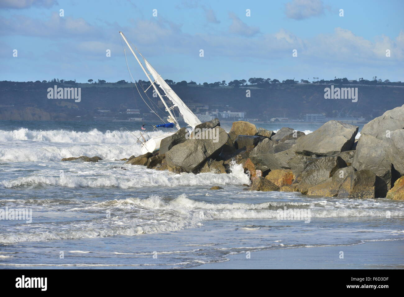A Yacht being ship wrecked on the rocks on the beach at San Diego ...