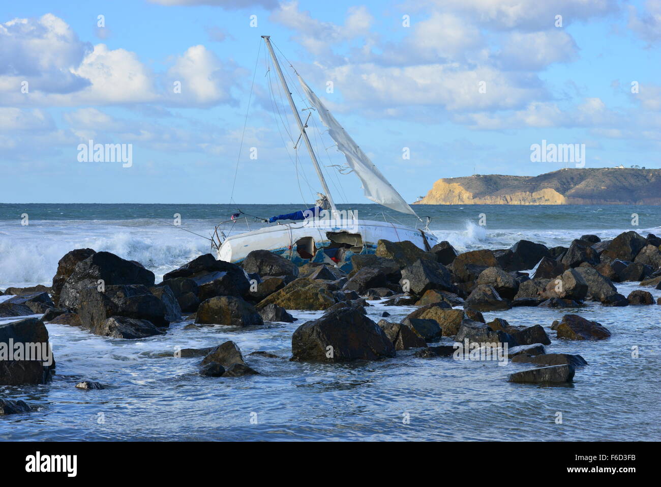 A Yacht being ship wrecked on the rocks on the beach at San Diego ...