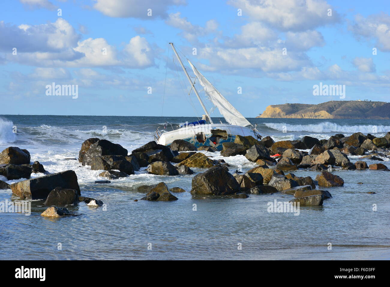 A Yacht being ship wrecked on the rocks on the beach at San Diego ...