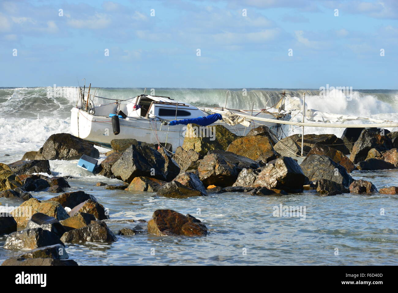 A Yacht being ship wrecked on the rocks on the beach at San Diego ...