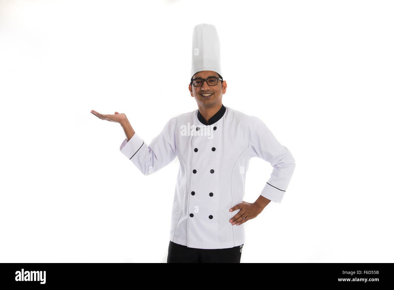 indian male chef introducing something Stock Photo - Alamy