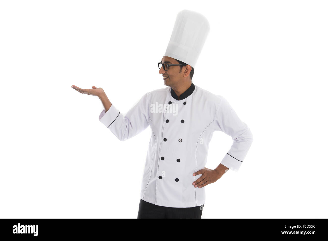 indian male chef introducing something Stock Photo - Alamy