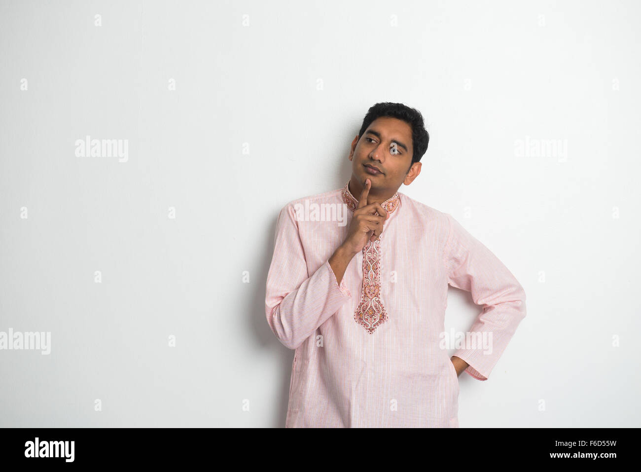 traditional indian male thinking with plain background and copyspace on ...