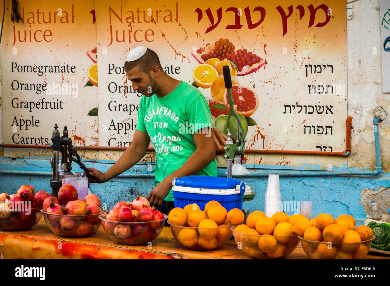 An outdoor kiosk selling fruit and pomegranate juice in Safed, Golan ...
