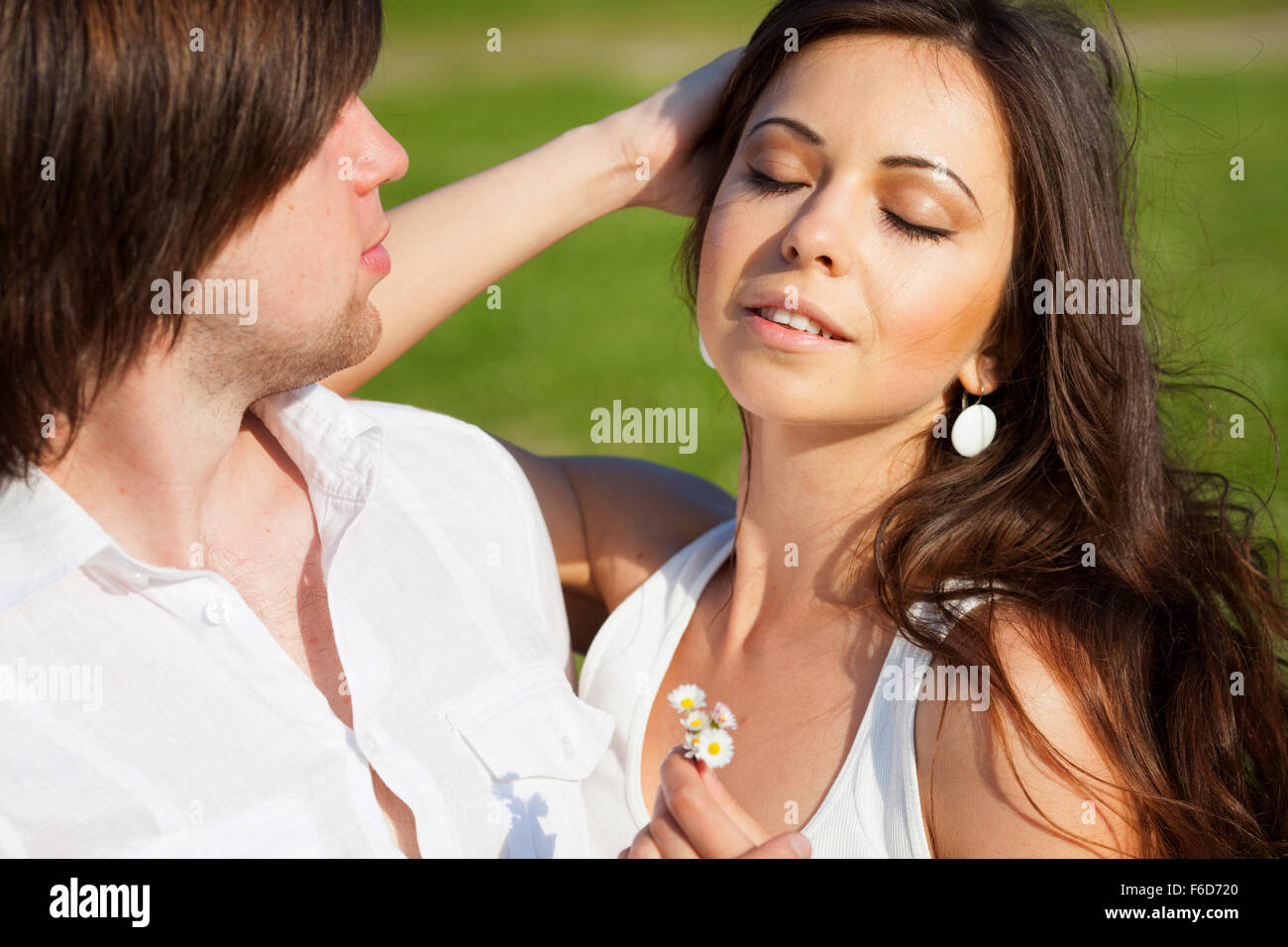 Two lovers on the meadow Stock Photo - Alamy