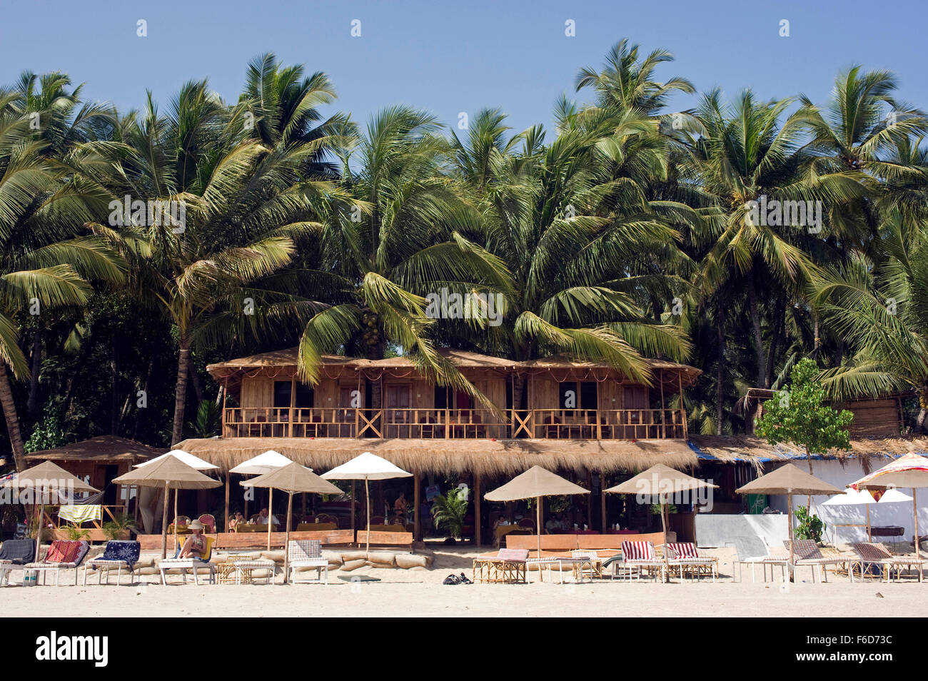Wooden shack umbrellas beds for tourists, palolem beach, goa, india ...