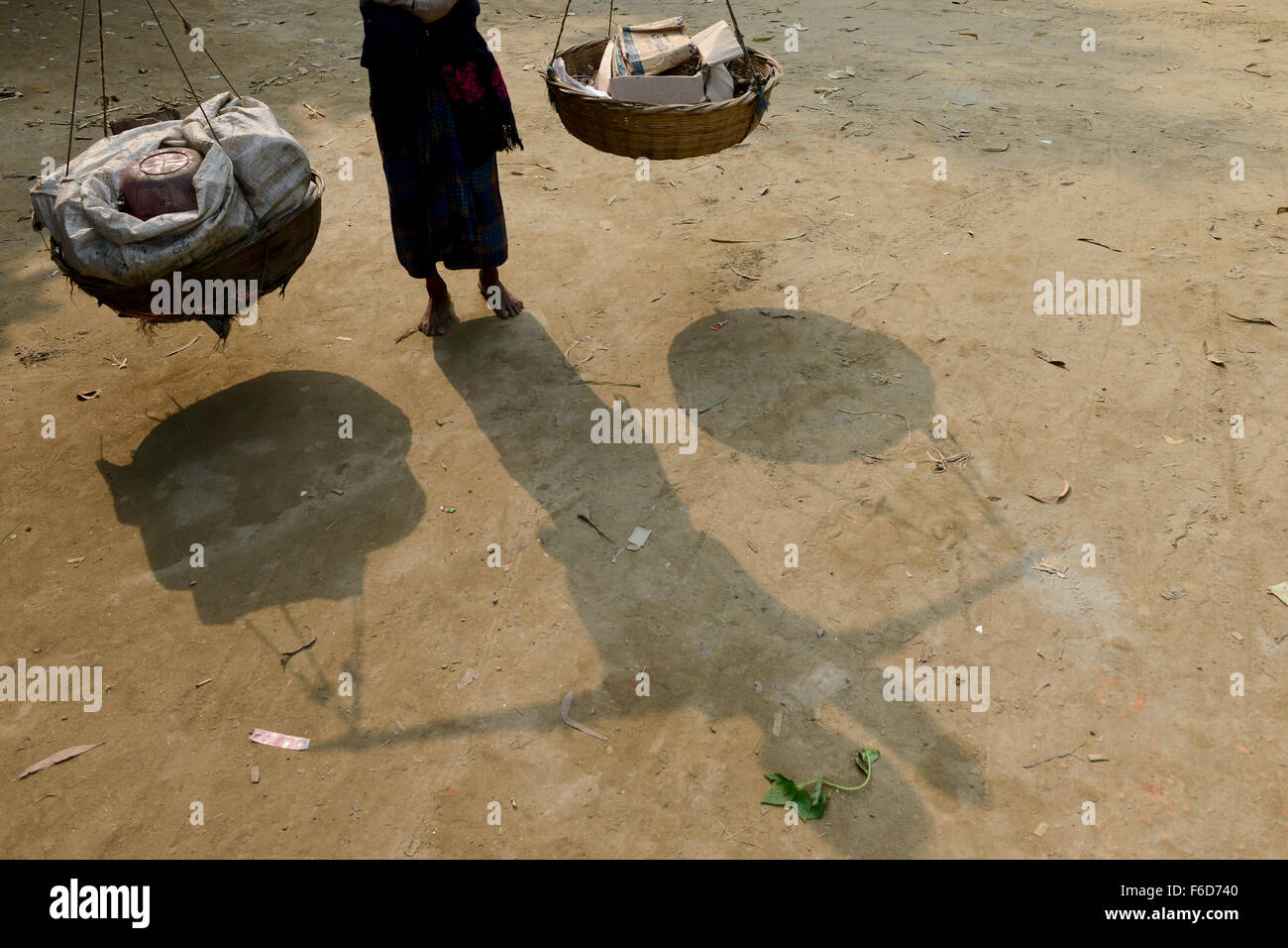 BANGLADESH Tangail, Kalihati, porter with yoke / BANGLADESCH, Distrikt ...