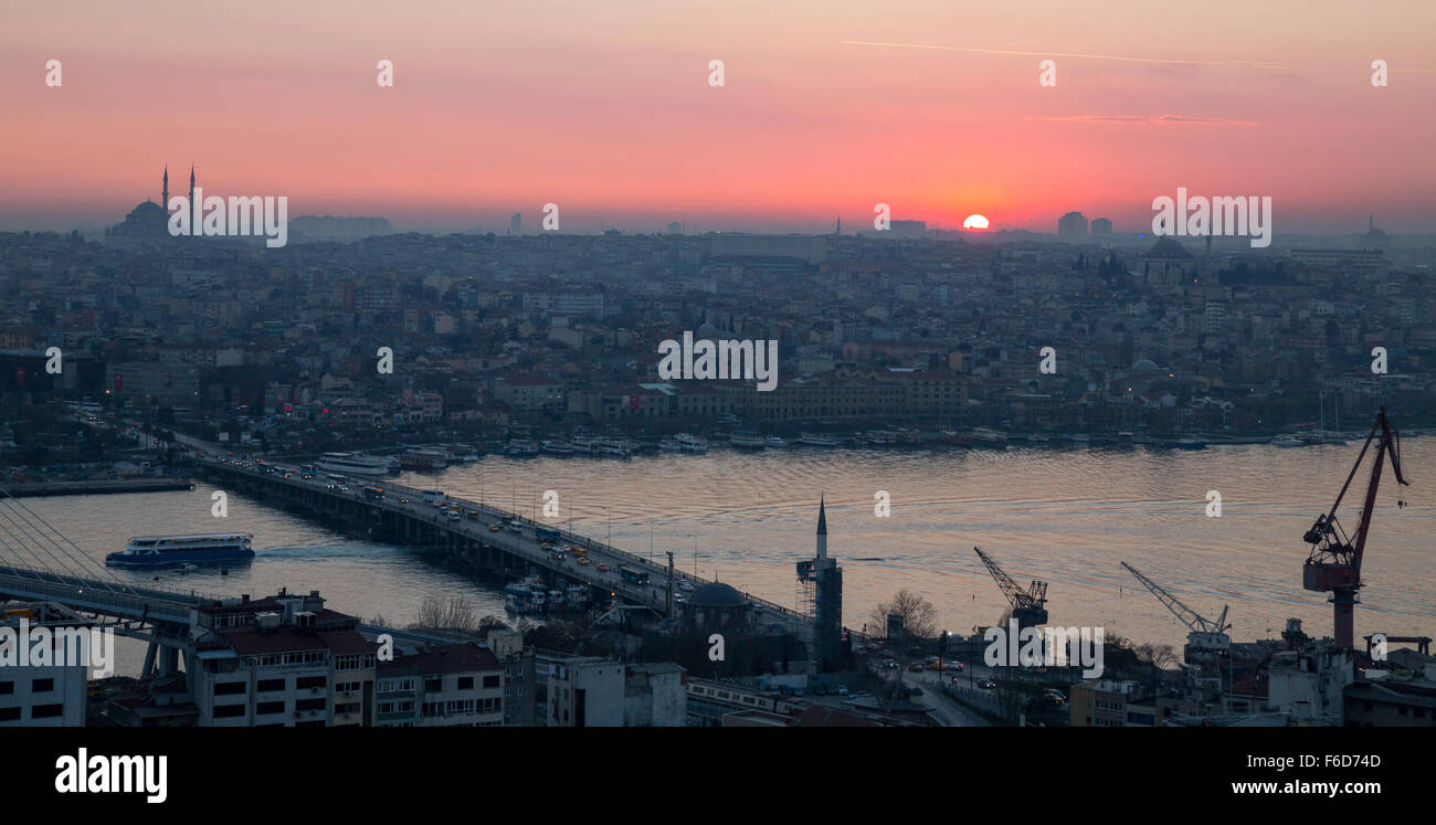 Profile view golden horn in Istanbul at dusk with mosque in the skyline ...