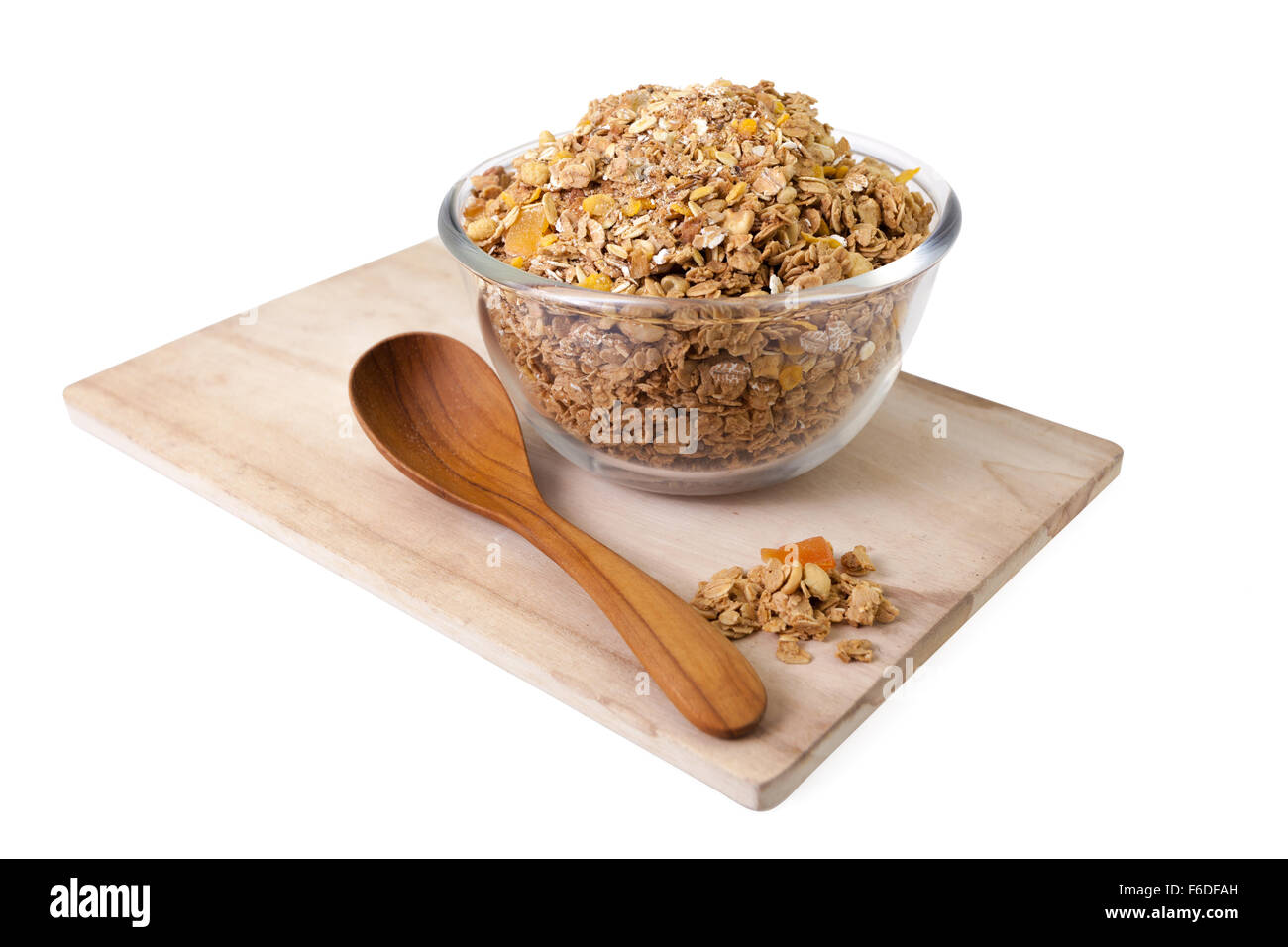 Granola cereal with dried fruits in bowl, isolated on white background ...