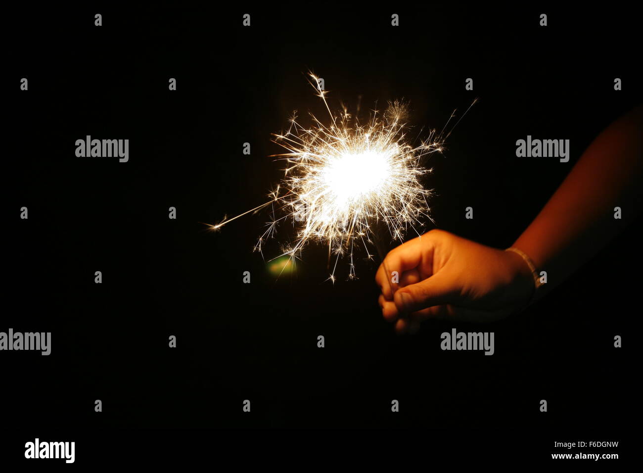 hand hold a spark fireworks Stock Photo - Alamy