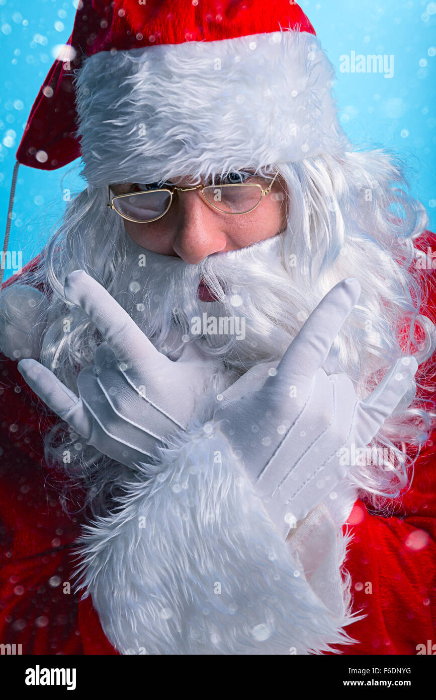 Portrait of a modern of Santa Claus on a blue background Stock Photo ...