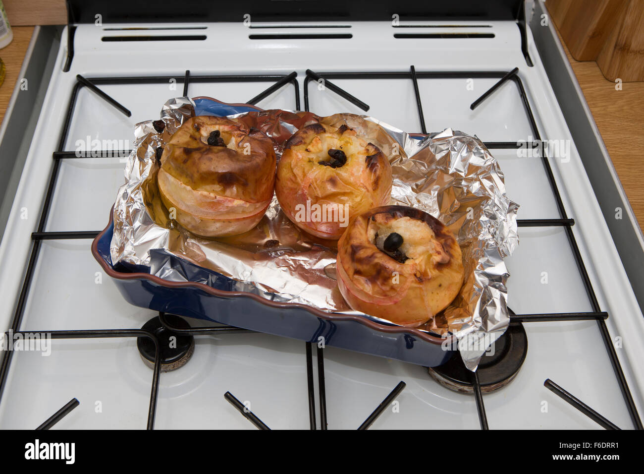 Baked apples on a cooker Stock Photo - Alamy