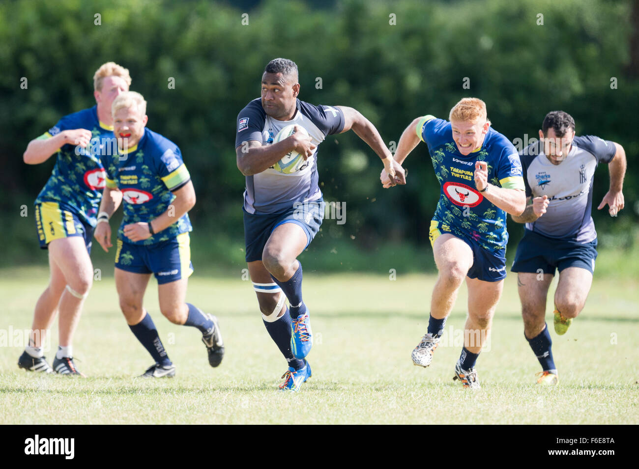 Rugby players in action Stock Photo - Alamy