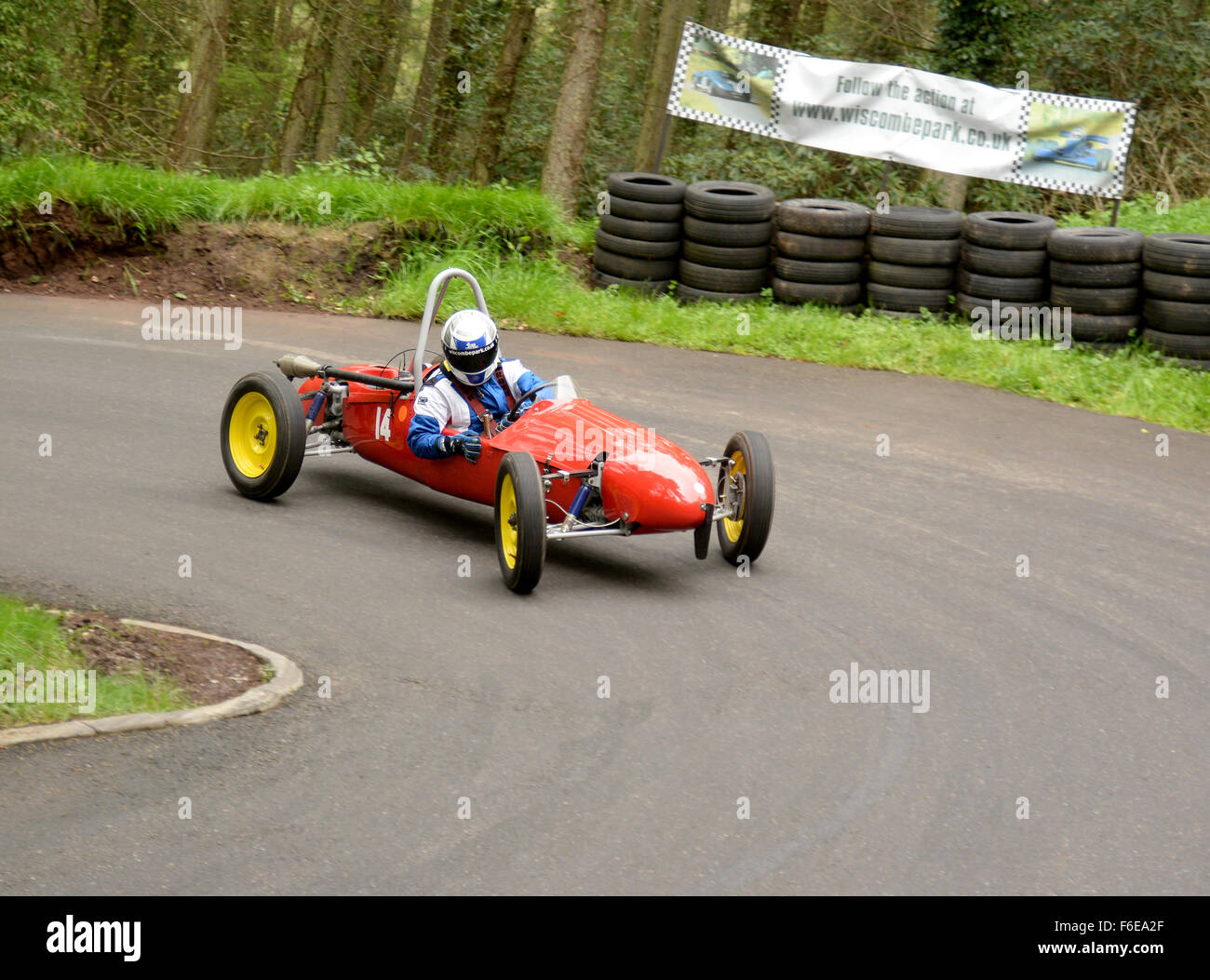 A race car speeds around a corner Stock Photo - Alamy