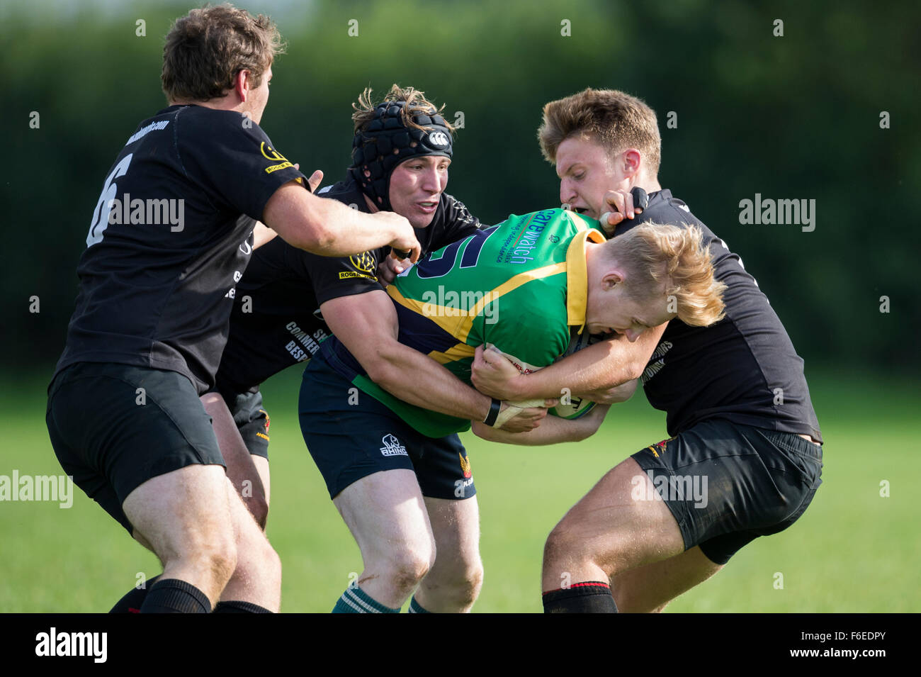 Rugby player being tackled Stock Photo - Alamy