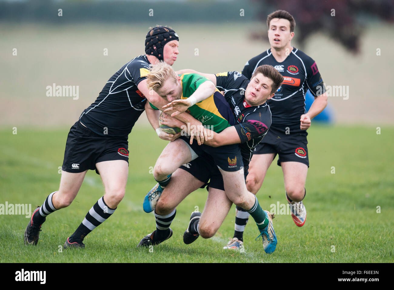 Rugby - player being tackled Stock Photo - Alamy