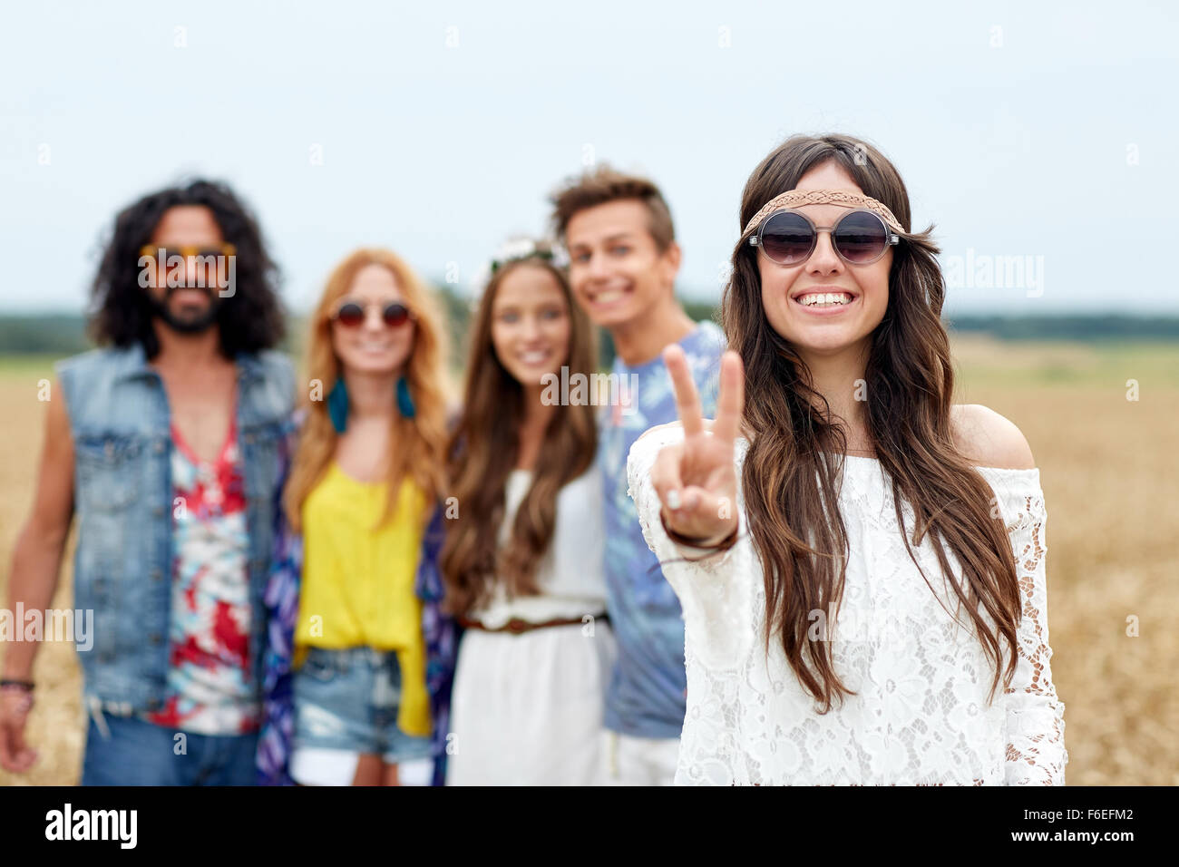 happy young hippie friends showing peace outdoors Stock Photo - Alamy