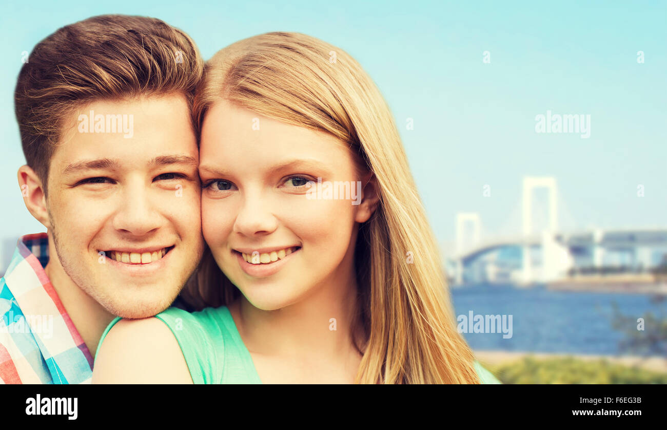 smiling couple over rainbow bridge in tokyo Stock Photo - Alamy