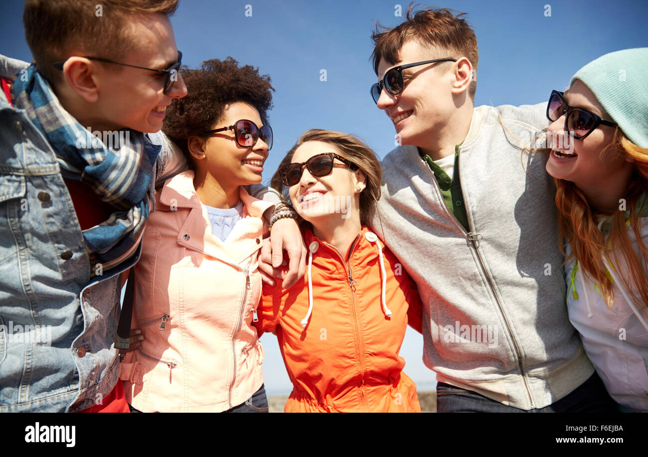 smiling friends in sunglasses laughing on street Stock Photo - Alamy