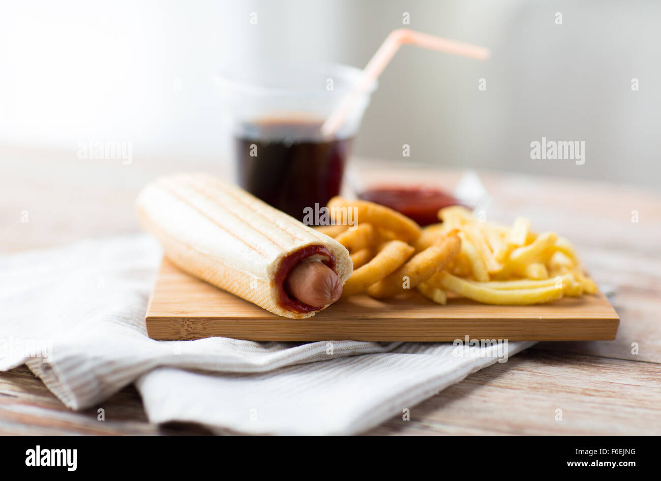 close up of fast food snacks and drink on table Stock Photo - Alamy
