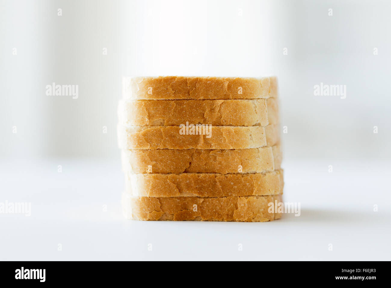 close up of white sliced toast bread pile on table Stock Photo - Alamy