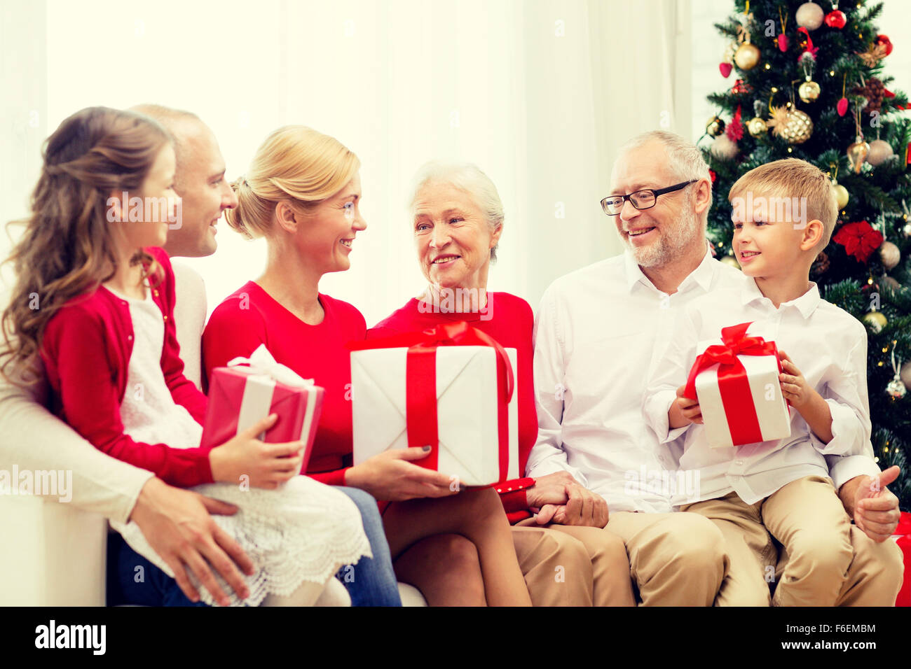smiling family with gifts at home Stock Photo - Alamy