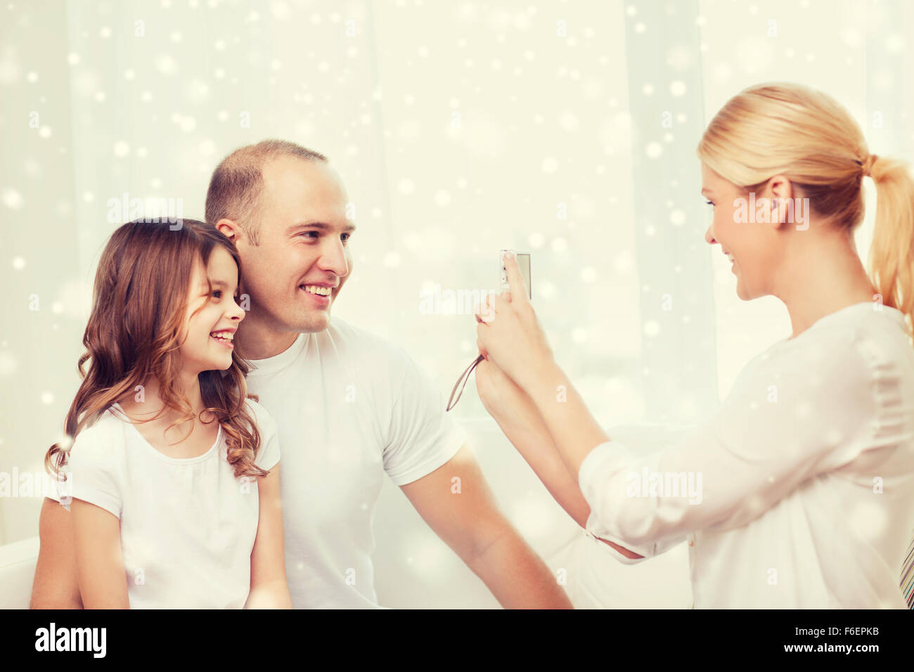 happy family with camera taking picture at home Stock Photo - Alamy
