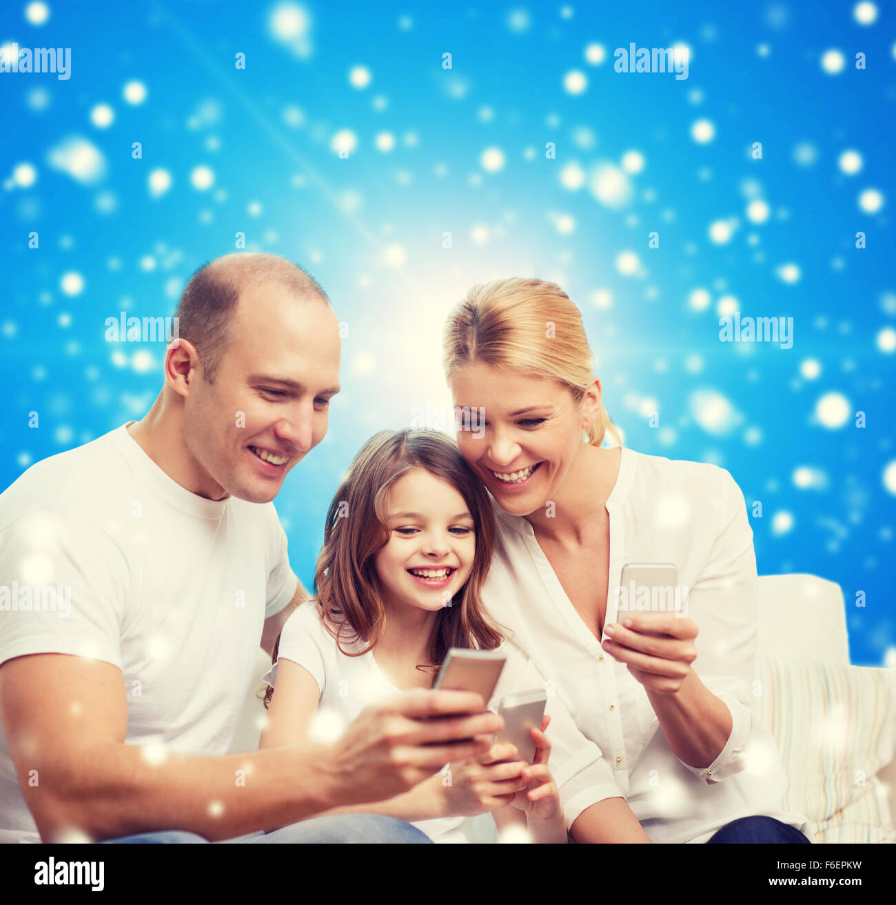 happy family with smartphones Stock Photo - Alamy