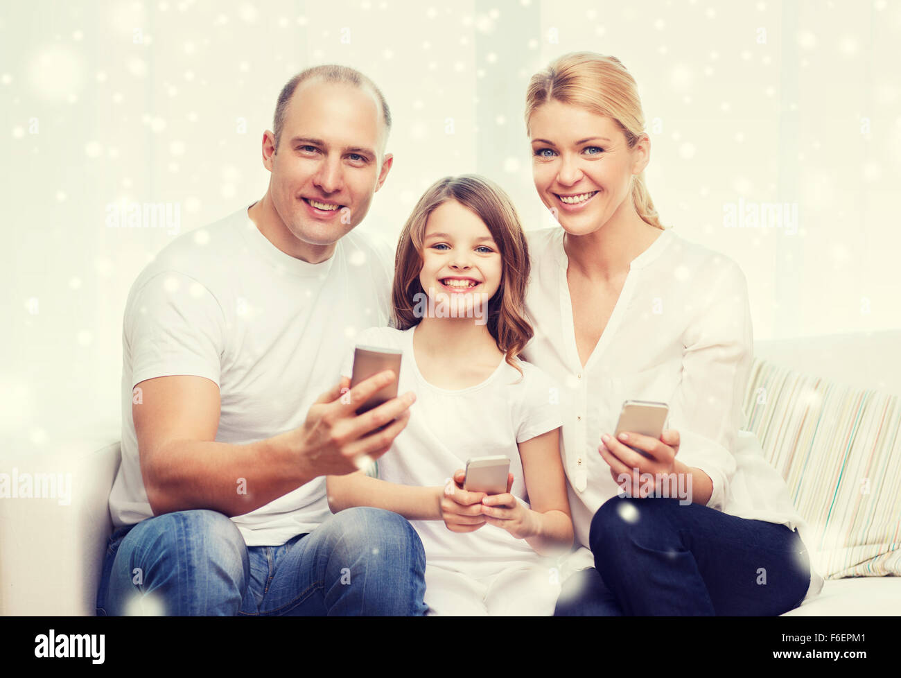 happy family with smartphones at home Stock Photo - Alamy